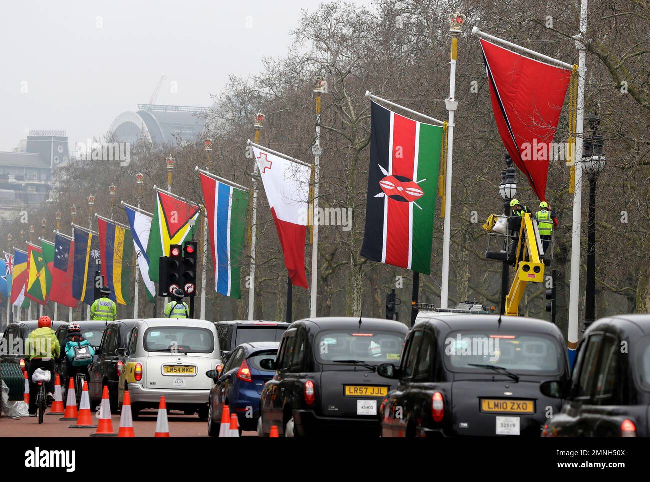 Flags of the Commonwealth countries are hung along The Mall in London ...