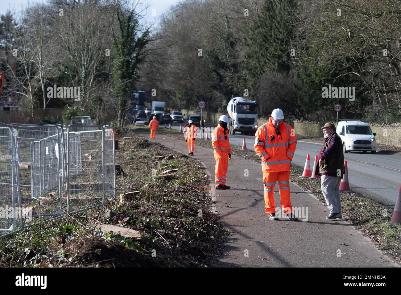 Hartwell, Aylesbury, UK. 30th January, 2023. A local resident (R) looks ...
