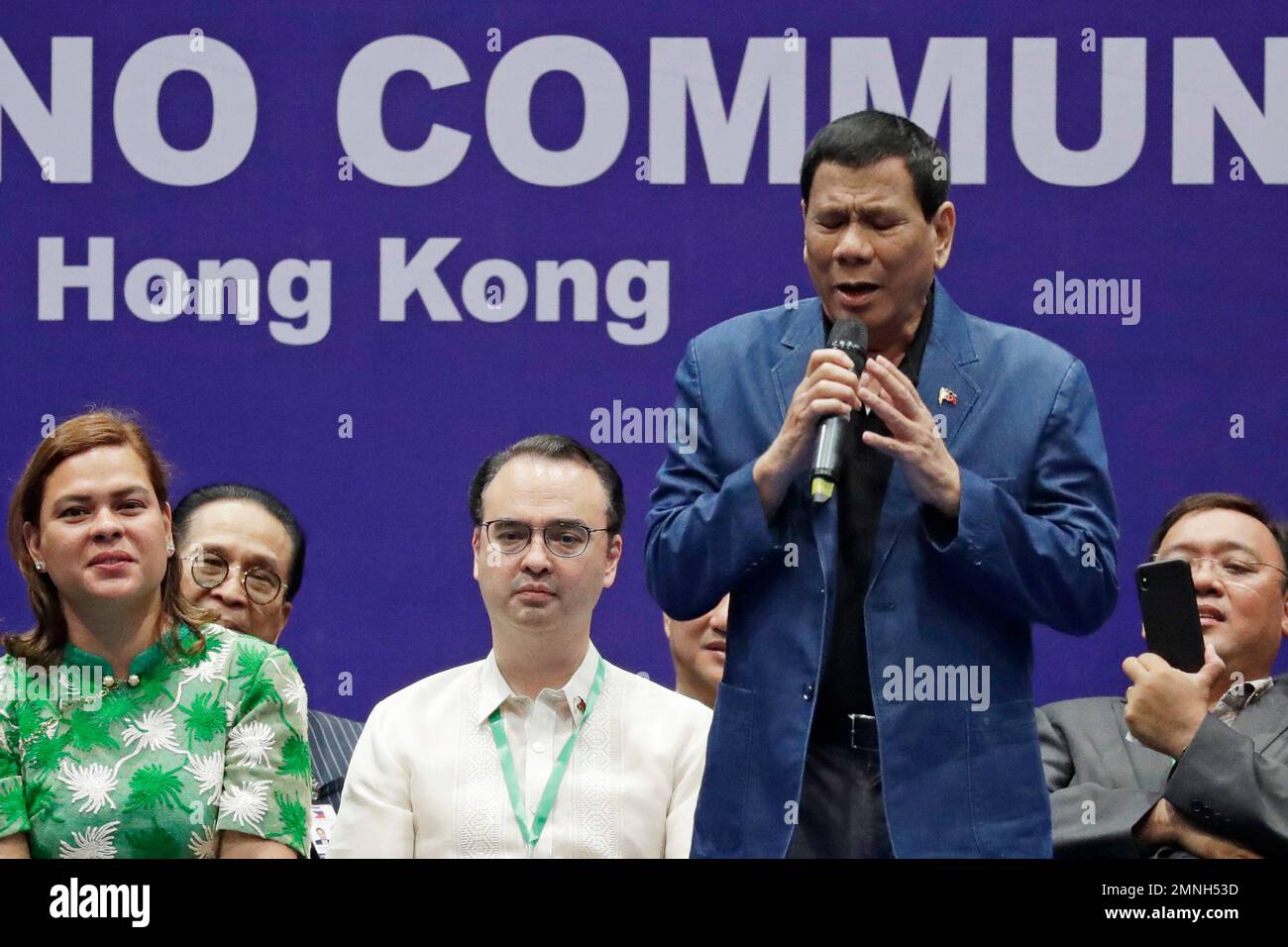 Philippine President Rodrigo Duterte sings as he attend a meeting with ...