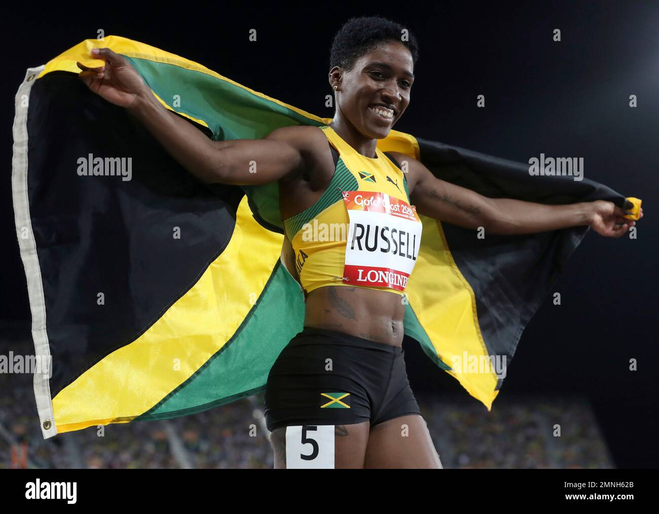 Jamaica's Janieve Russell celebrates after winning the women's 400m ...