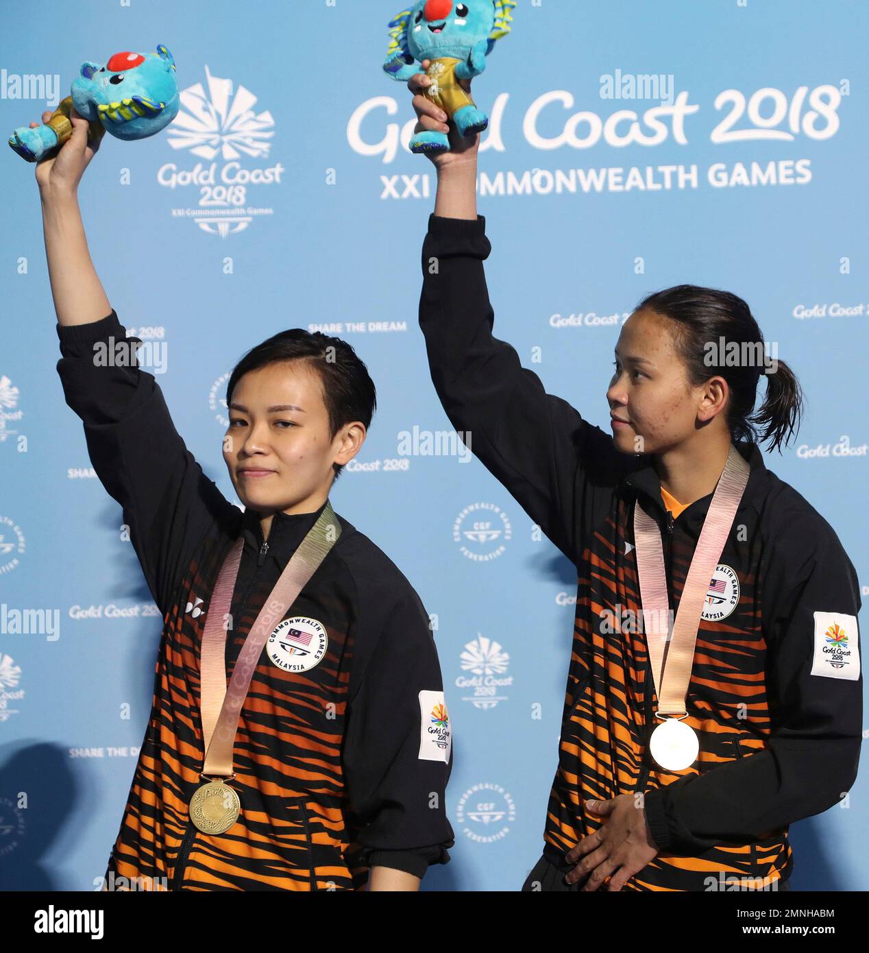 Malaysia's Jun Hoong Cheong, left, and Pandelela Rinong Pamg wave after ...