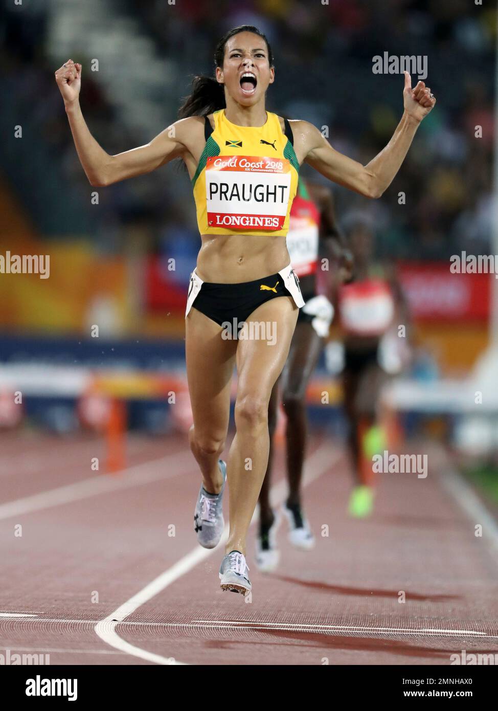 Jamaica's Aisha Praught celebrates as she crosses the finish line to ...