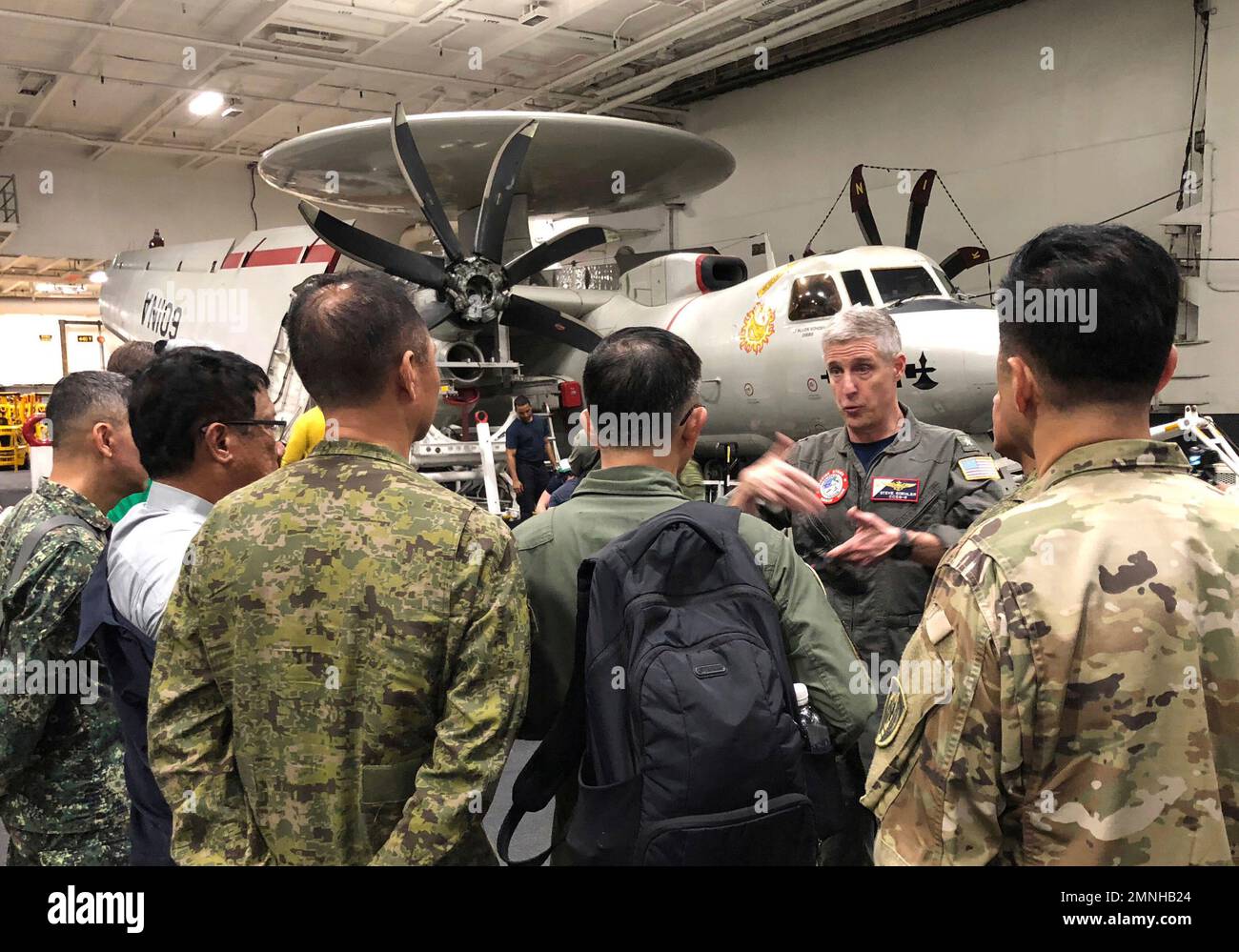 Rear Admiral Steve Koehler, facing camera, commander CSG-9 of the U.S ...