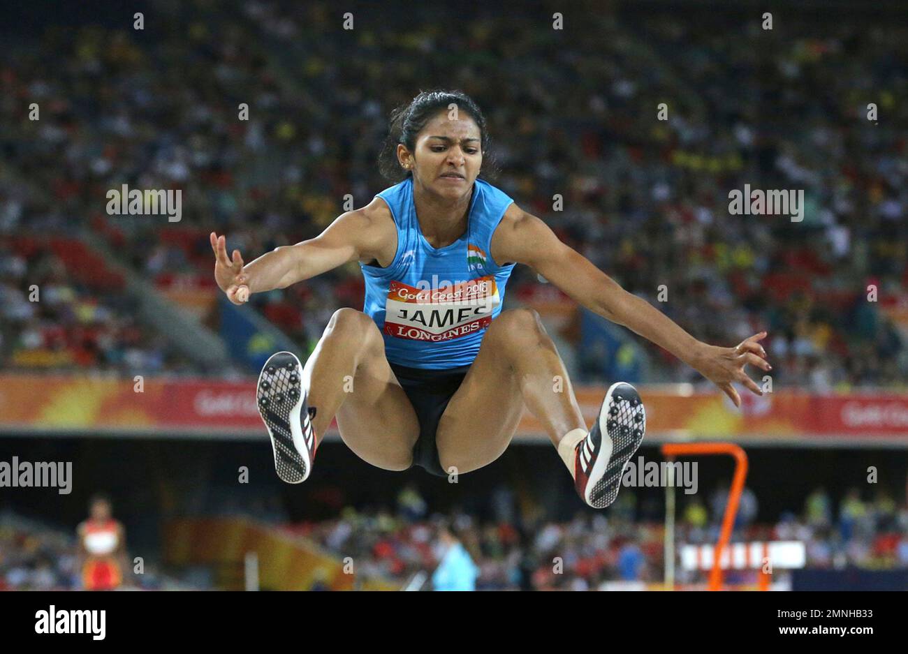 India's Nayana James competes in the women's long jump qualifiers at ...