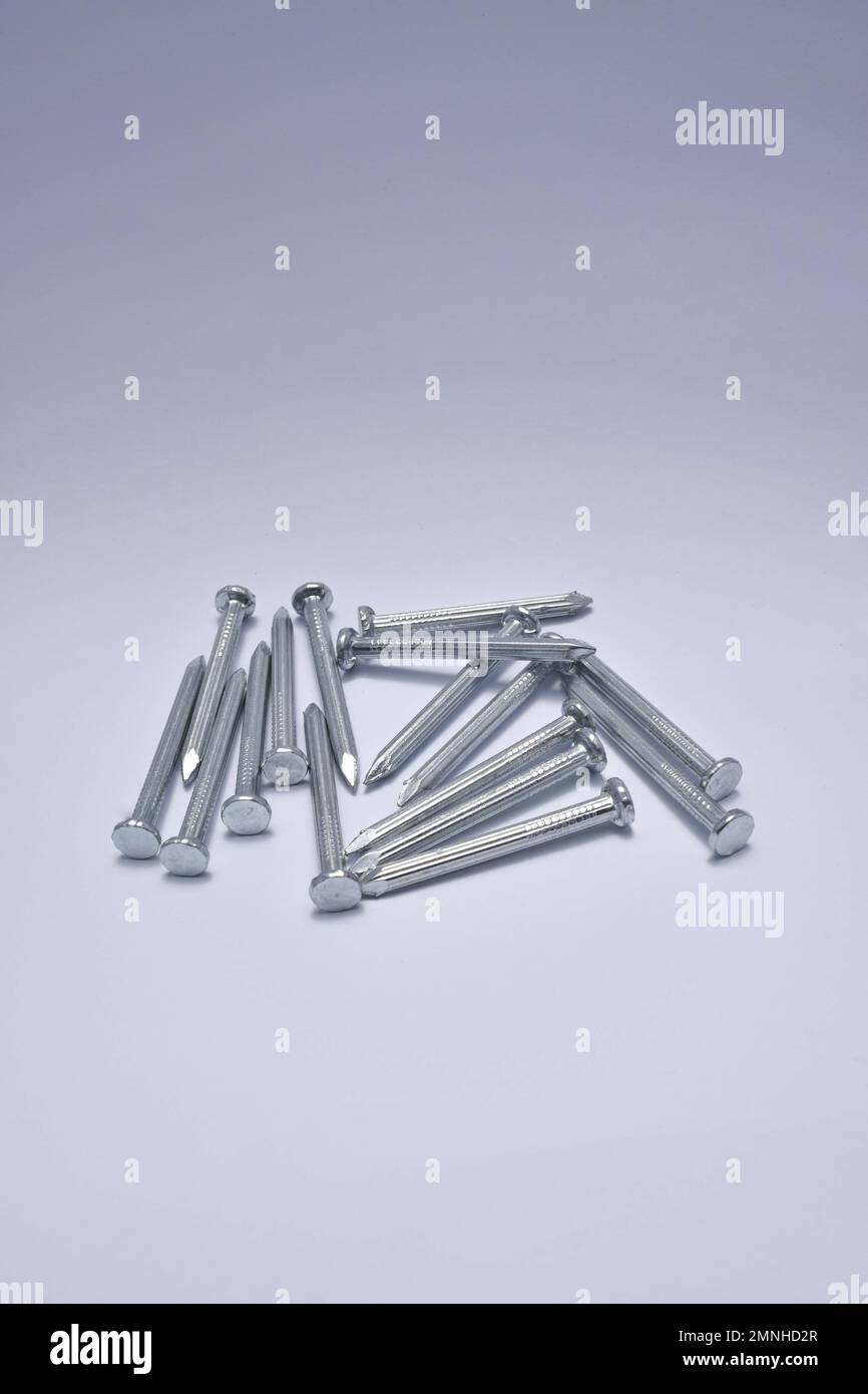 steel nail isolated on white background. Shiny silver nails Stock Photo ...
