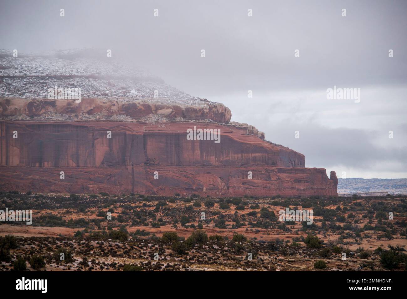 Merrimac and Monitor Butte stand guard just outside of Canyonlands ...
