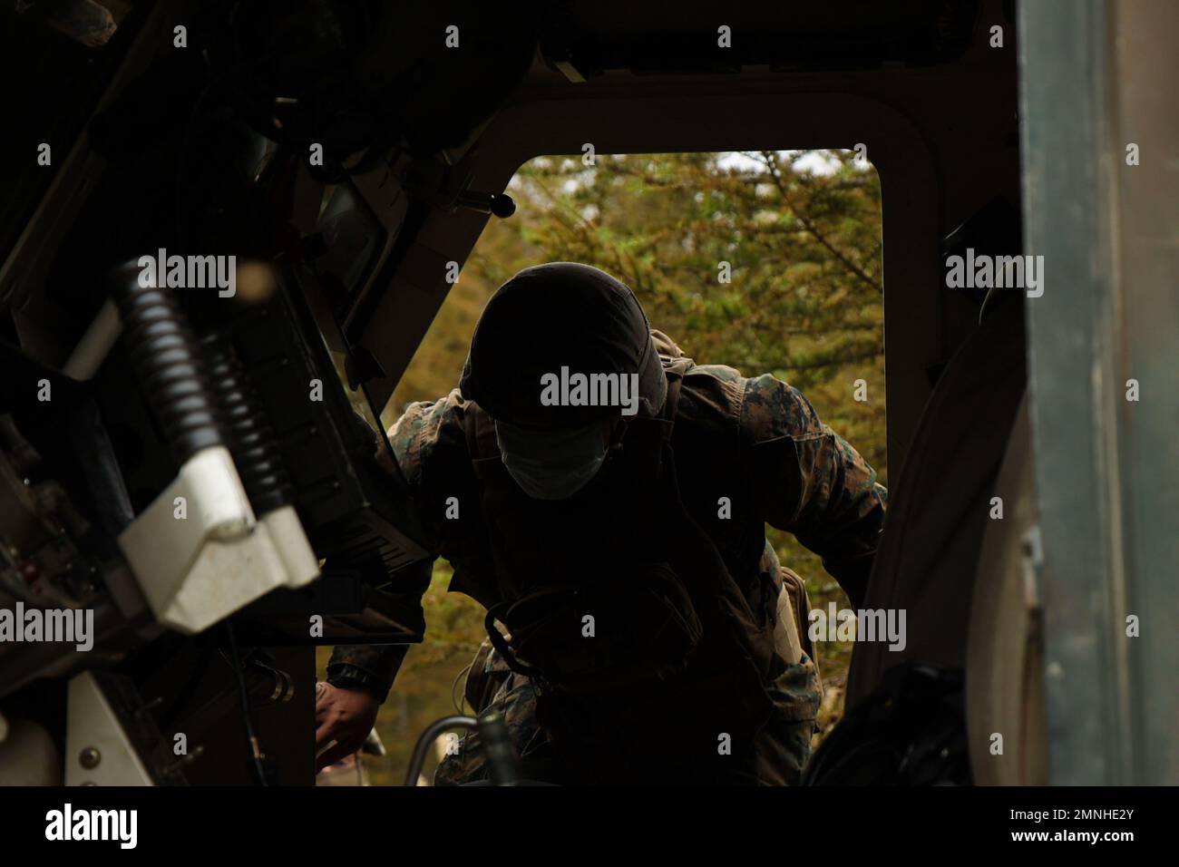 A U.S. Marine with 12th Marine Regiment, 3d Marine Division, enters an ...