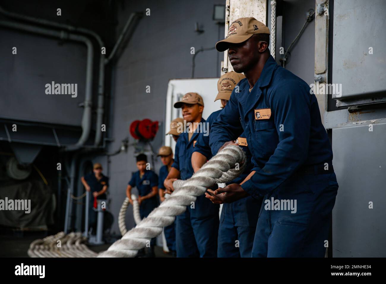SAN DIEGO (Oct. 3, 2022) Sailors slack lines on the fantail while ...