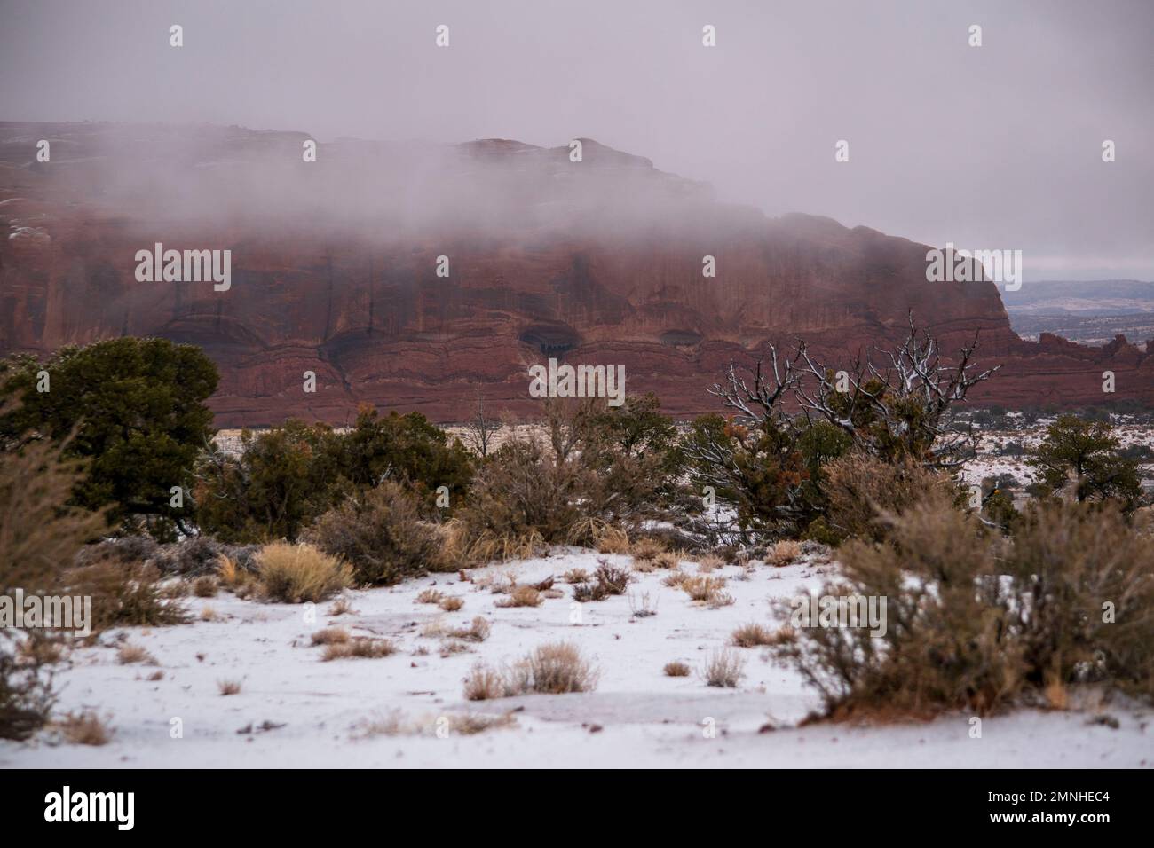 Merrimac and Monitor Butte stand guard just outside of Canyonlands ...