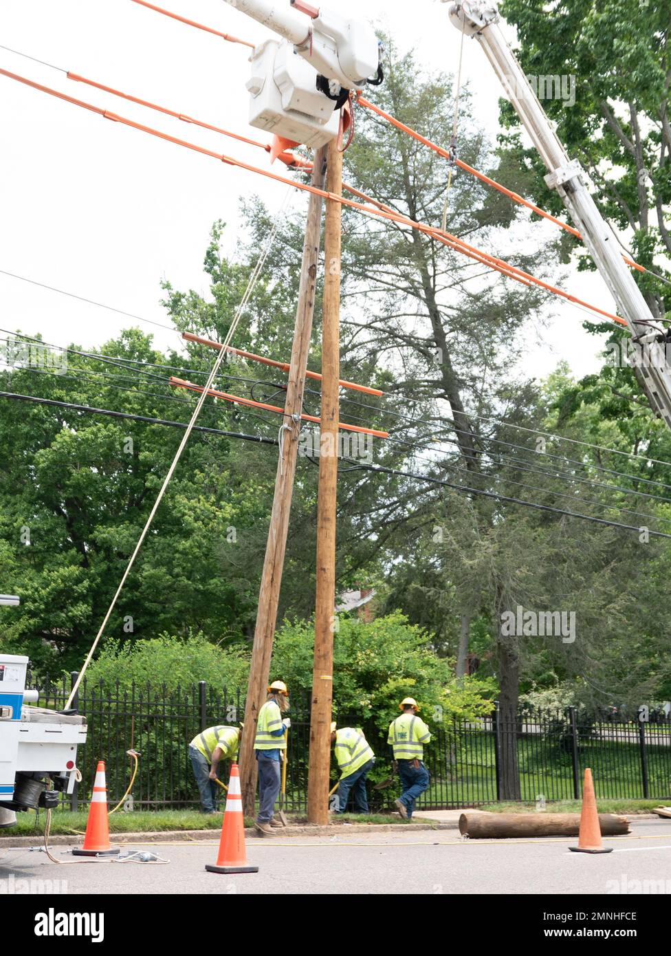 Crane lifting steel utility pole hi-res stock photography and images ...