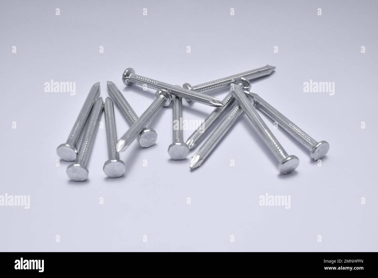steel nail isolated on white background. Shiny silver nails Stock Photo ...