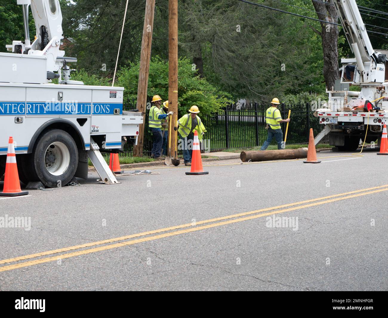 Crane lifting steel utility pole hi-res stock photography and images ...