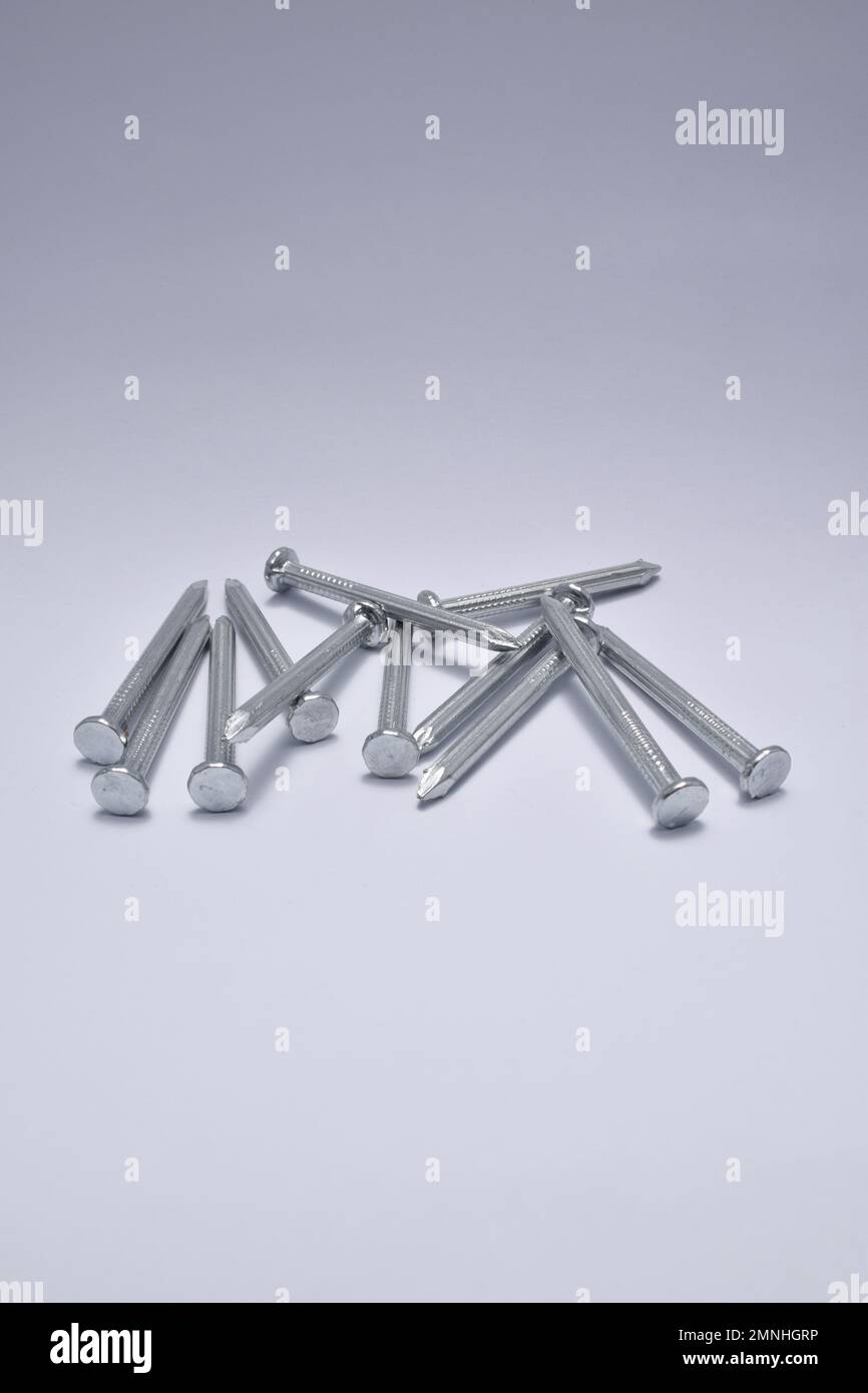 steel nail isolated on white background. Shiny silver nails Stock Photo ...
