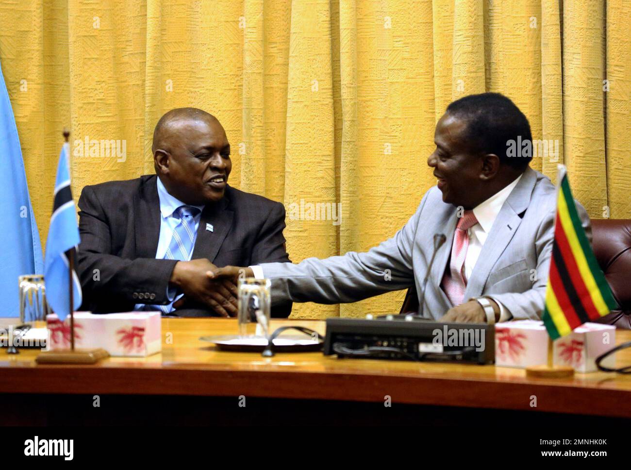 Botswana's new President Mokgweesti Masis, left, meets with Zimbabwean ...