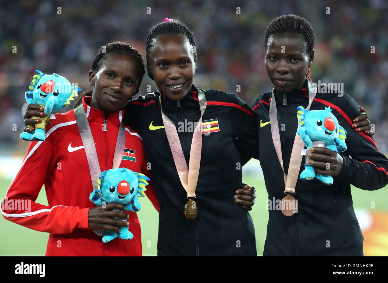 Women's 10,000m gold medalist Uganda's Stella Chesang, centre, stands ...
