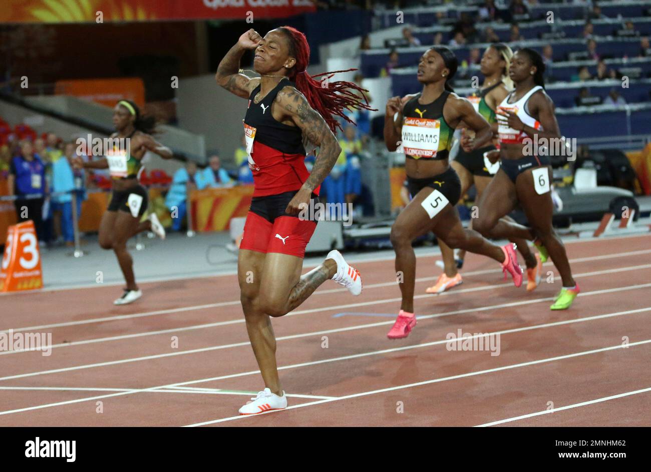 Michelle-Lee Ahye of Trinidad and Tobago crosses the finish line to win the women's 100m final ...