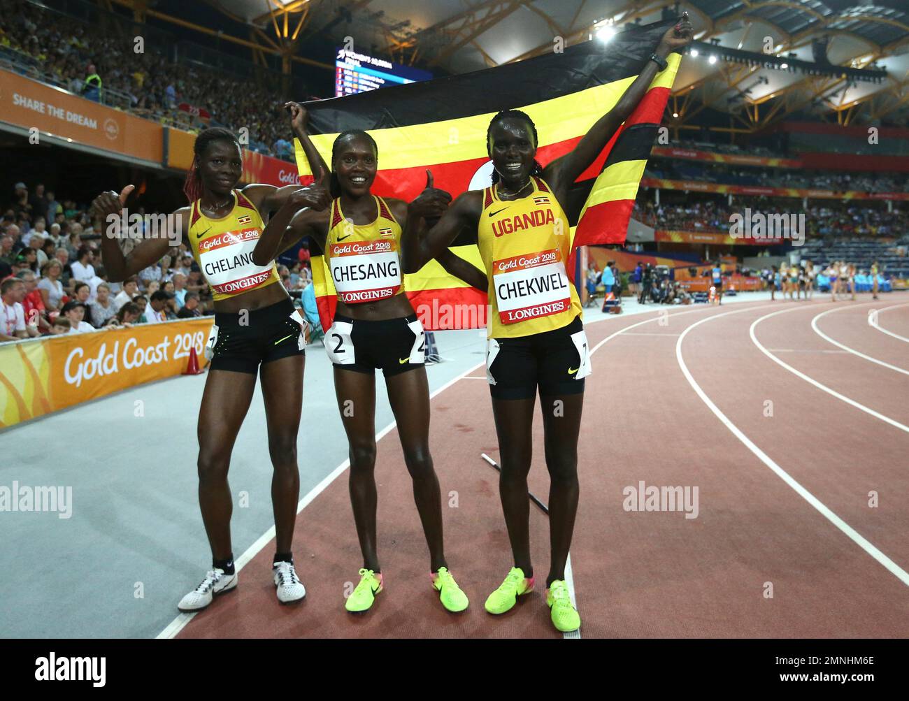 Uganda's Stella Chesang, centre, celebrates her win in the women's 10 ...