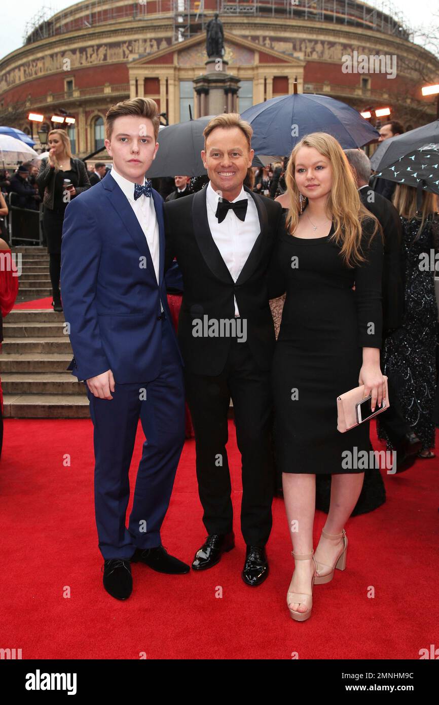 Jason Donovan and his children Jemma and Zac pose for photographers ...