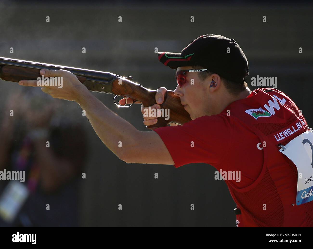 Ben Llewellin of Wales fires in the men's Skeet final at the Belmont ...