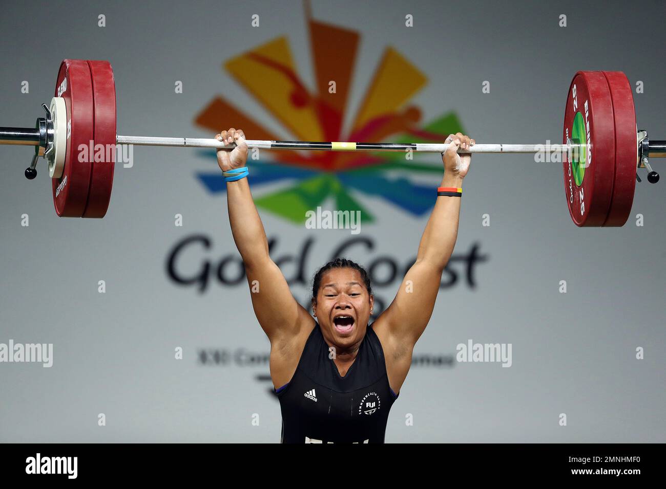 Eileen Cikamatana of Fiji lifts while competing in the clean and jerk ...