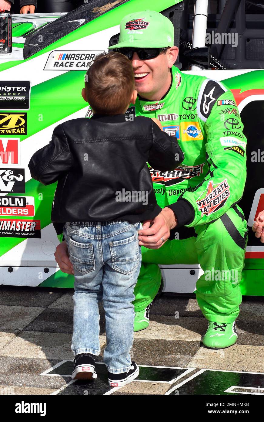 Kyle Busch celebrates with his son Brexton Locke in victory lane after ...