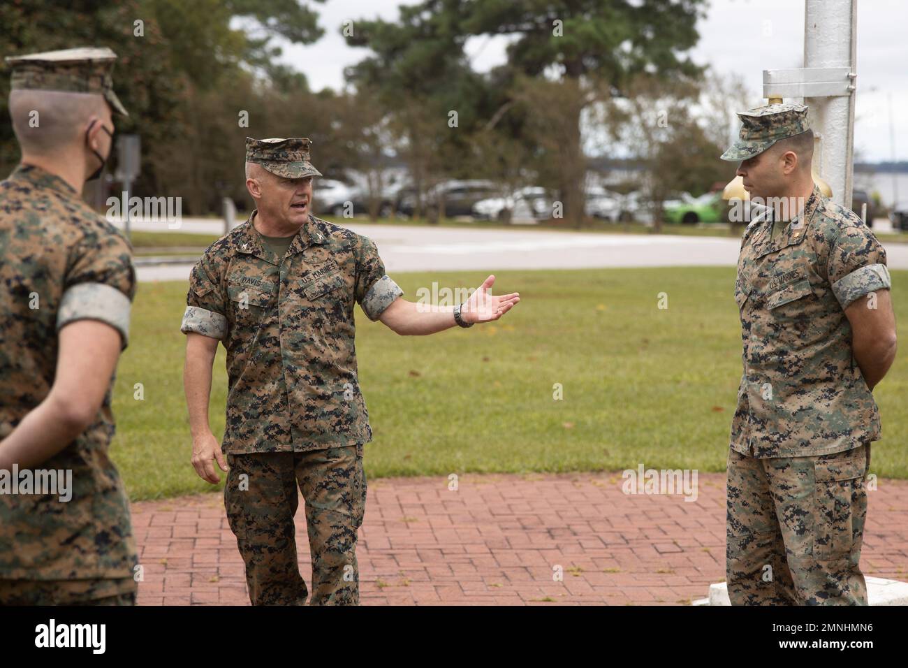 U.S. Marine Corps Col. Thomas Davis, center, speaks during a promotion ceremony for Maj. Learlin ...