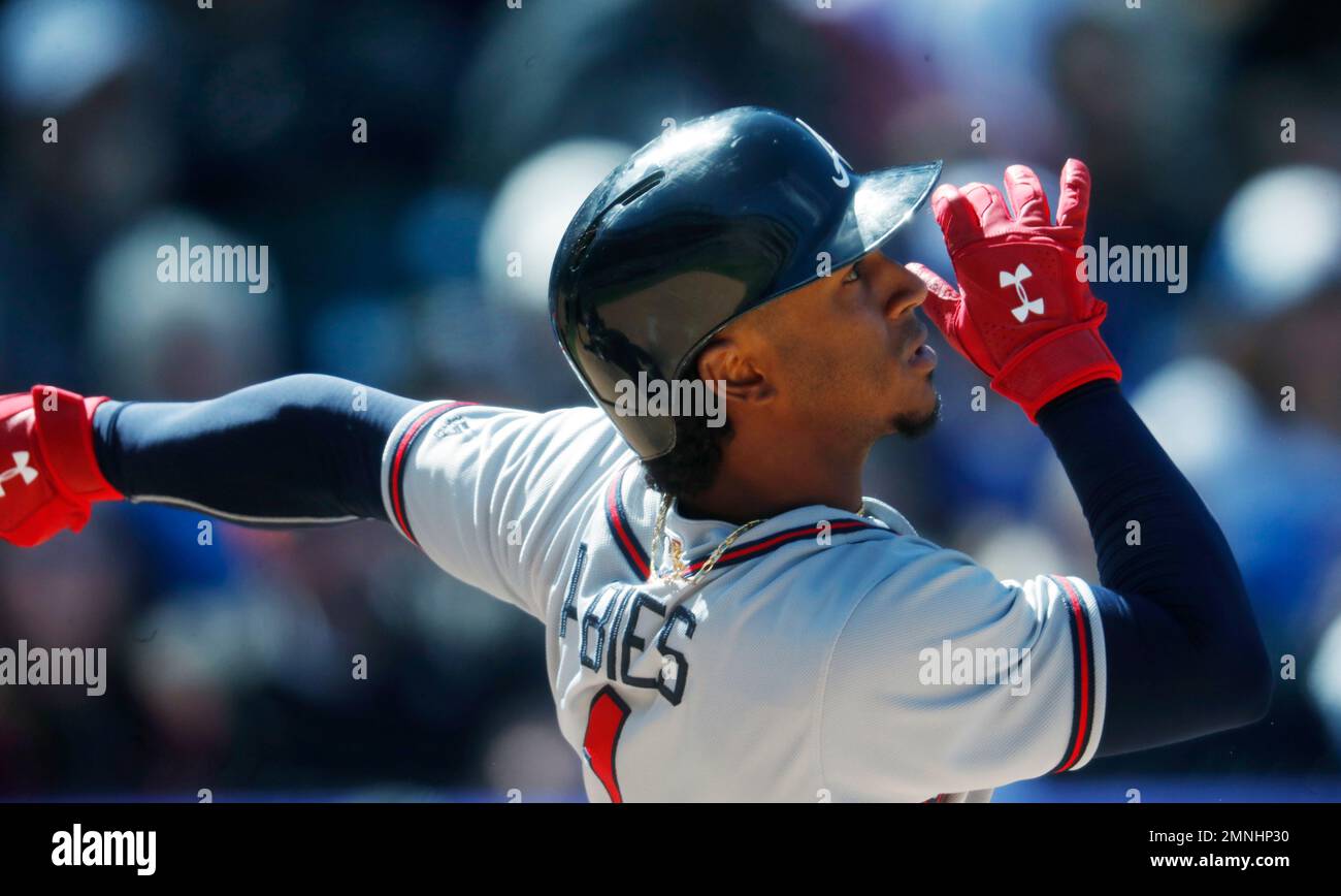 Atlanta Braves' Ozzie Albies follows the flight of his solo home run ...