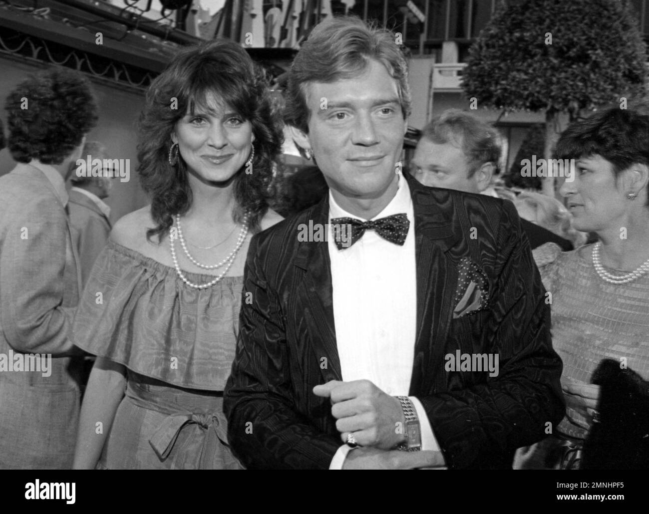 Anthony Andrews with Holly Palance at the premiere of Annie at Mann's ...
