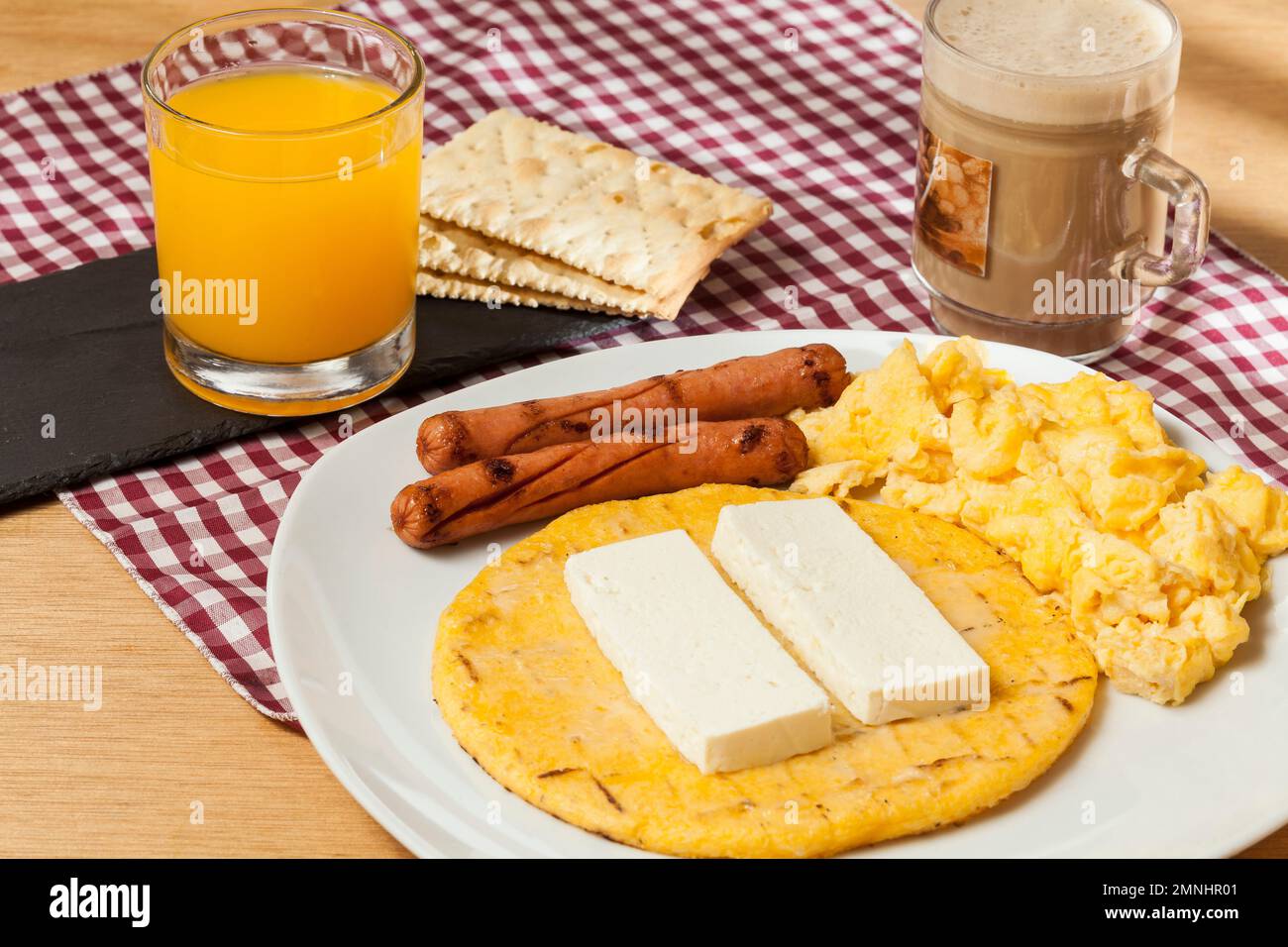 Tasty traditional breakfast in Colombia; Arepa of yellow corn with ...