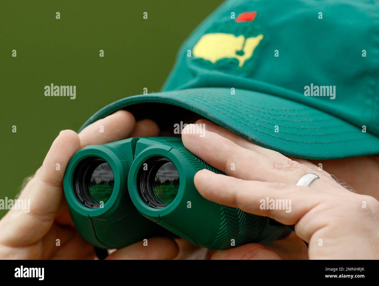 A fan looks out over the ninth hole during the fourth round at the ...