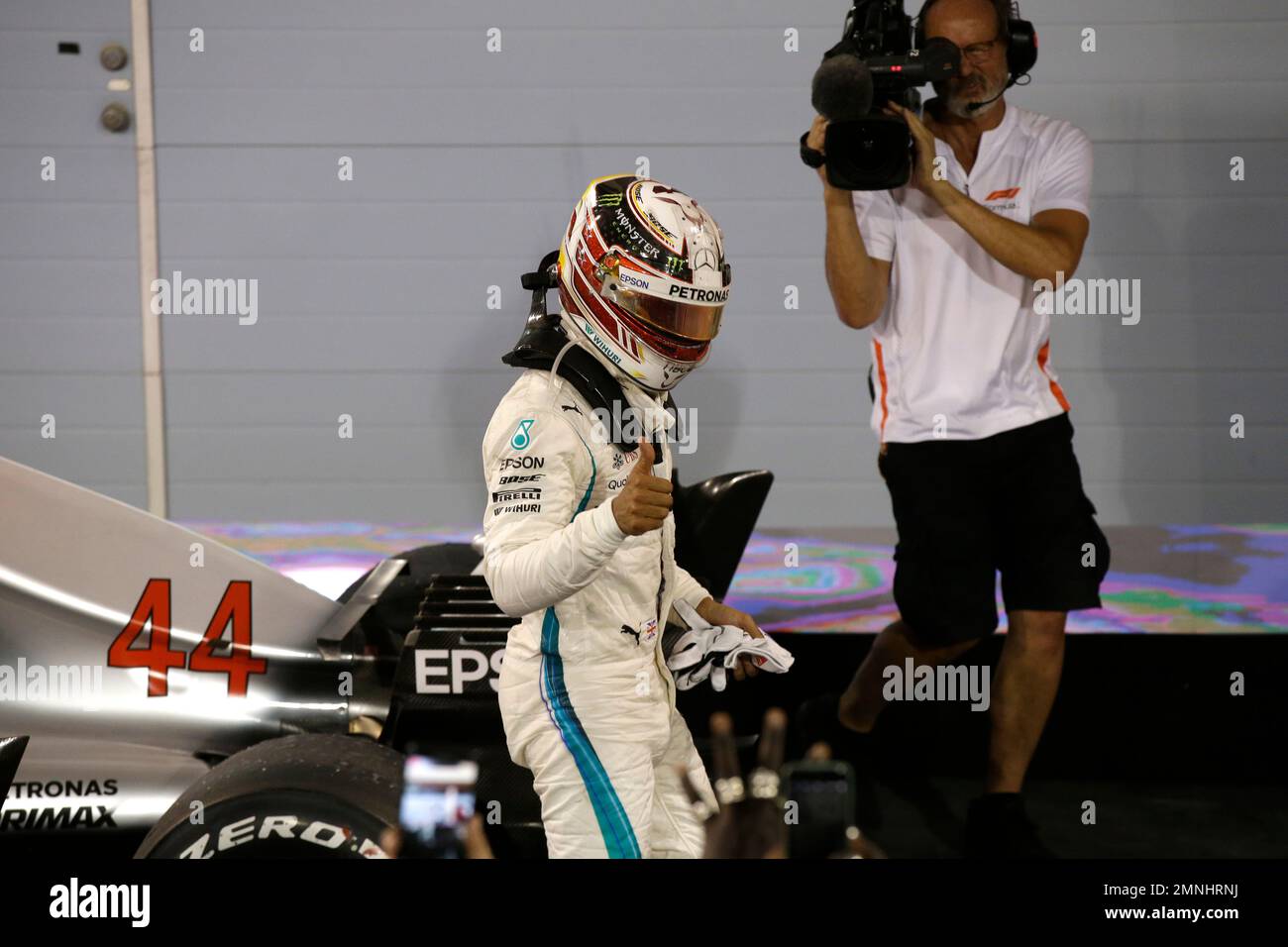 Mercedes driver Lewis Hamilton of Britain raises his thumb-up after ...