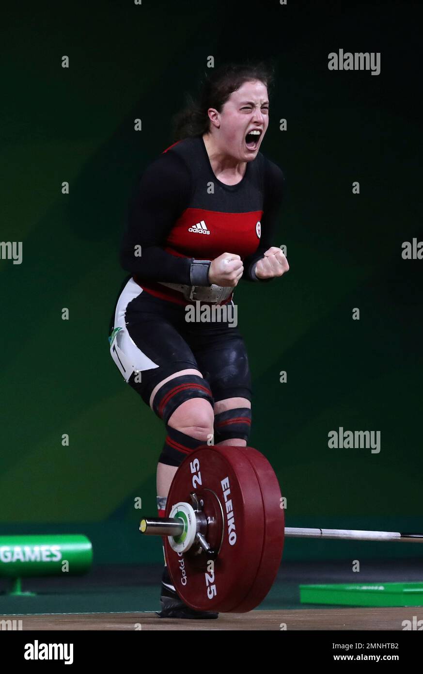 Canada's Marie-Eve Beauchemin-Nadeau celebrates after a successful lift ...