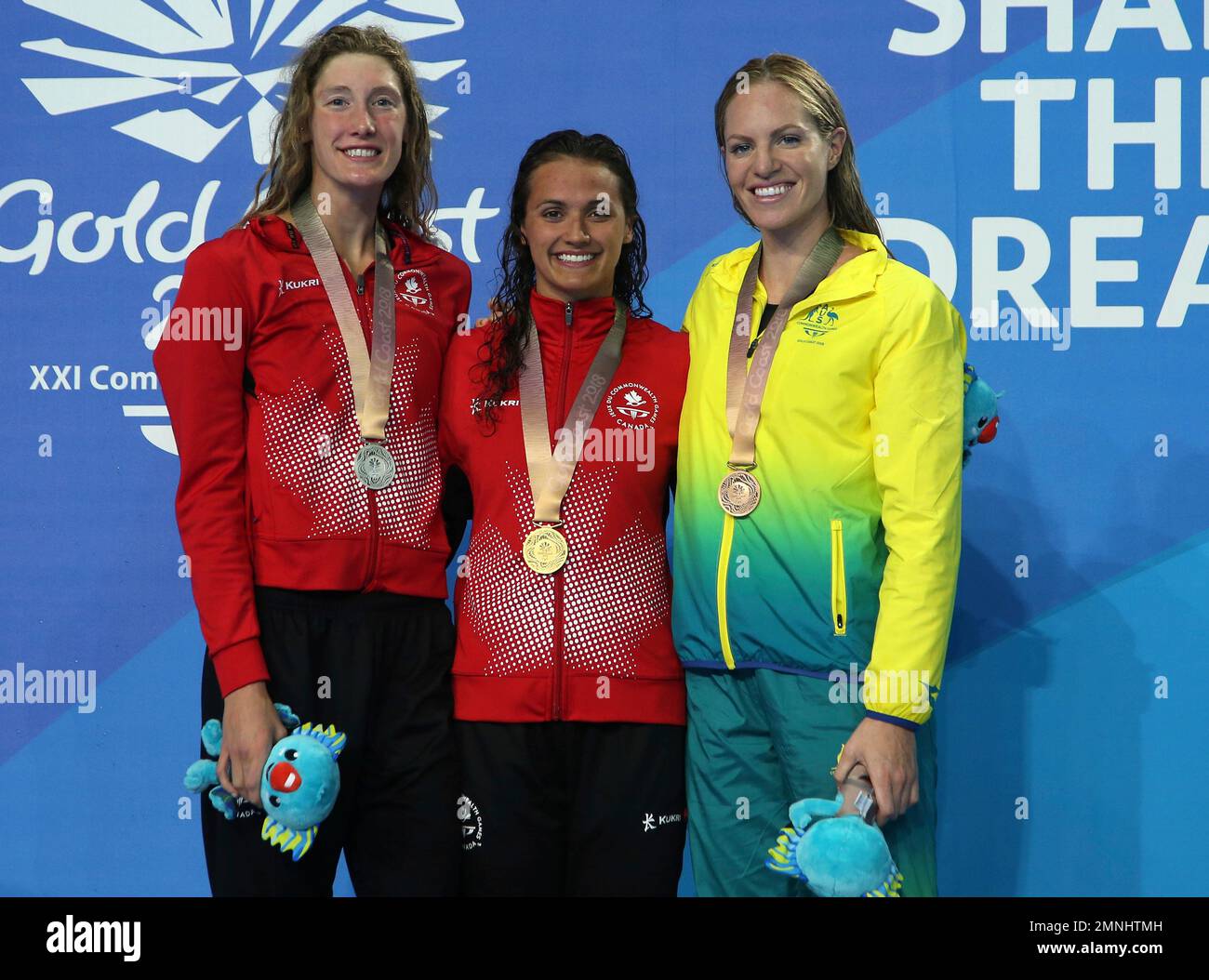 Women's 200m backstroke gold medalist Canada's Kylie Masse, centre ...