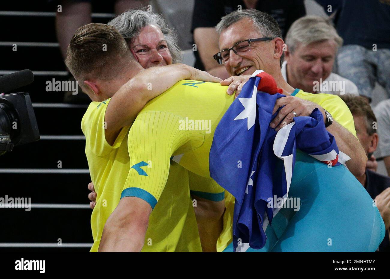 Australia's Matt Glaetzer is hugged by his parents after winning gold ...