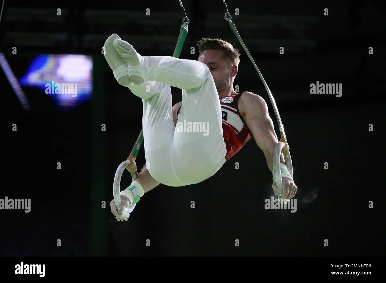 Scott Morgan of Canada competes on the rings during the artistic ...