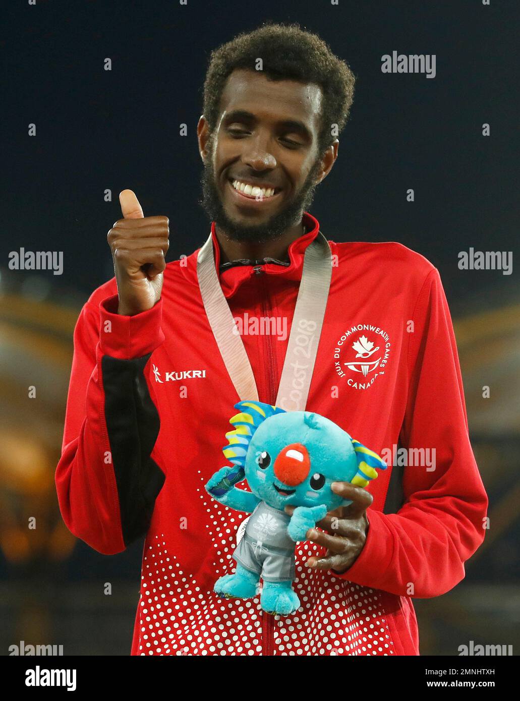 Men's 5000m silver medalist Canada's Mohammed Ahmed gestures on the ...