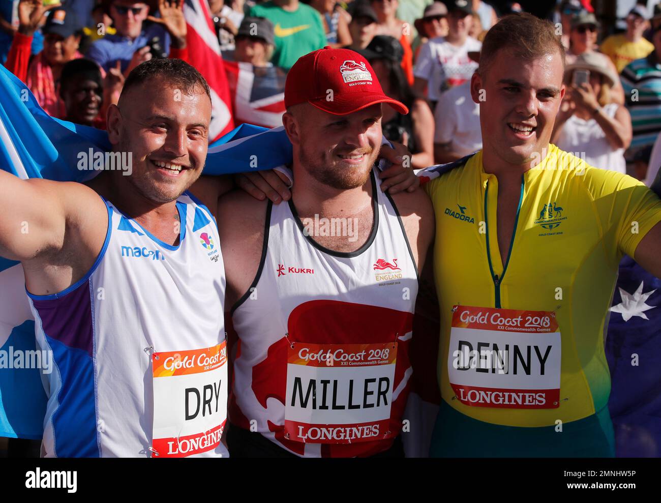 Men's hammer throw gold medalist England's Nick Miller, centre ...