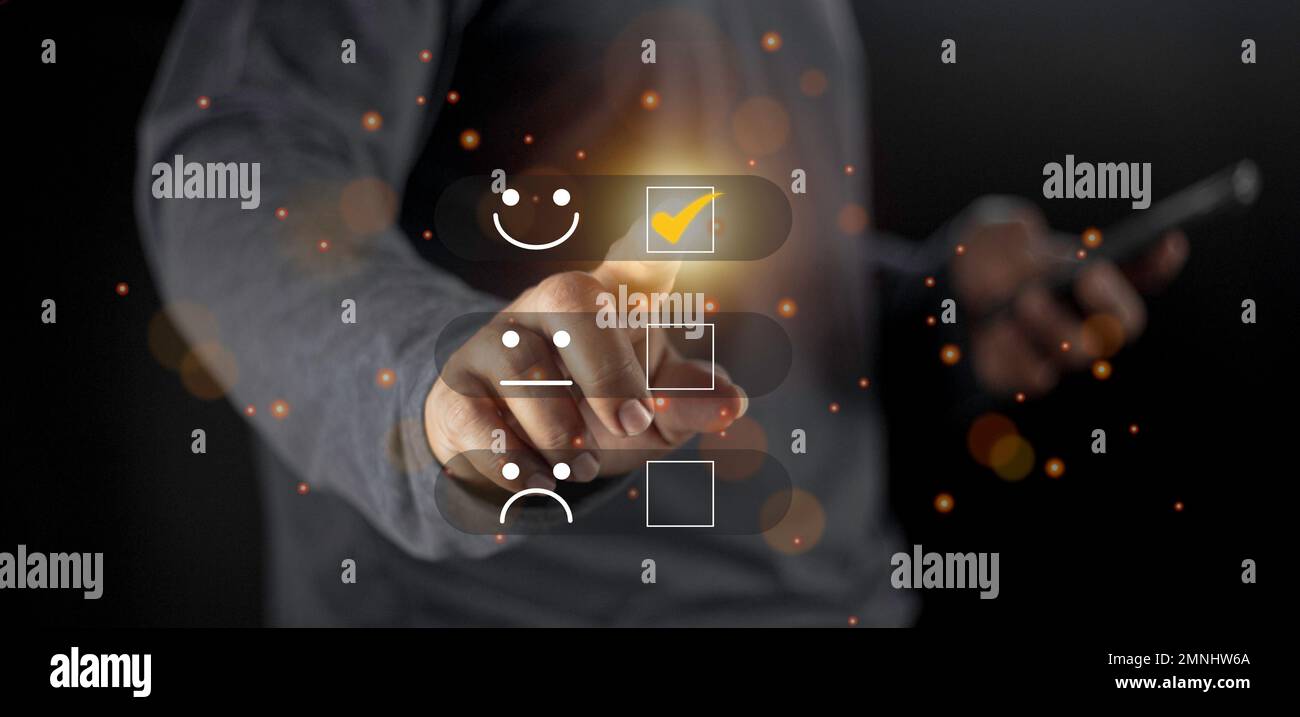 Businessman pressing smiley face emoticon on virtual touch screen. User ...