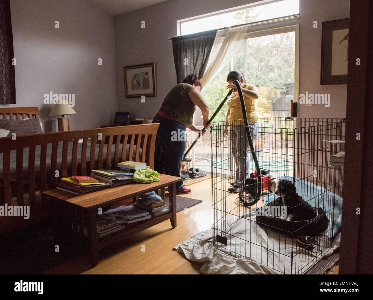 Hispanic women are doing house cleaning work for a personal residence ...