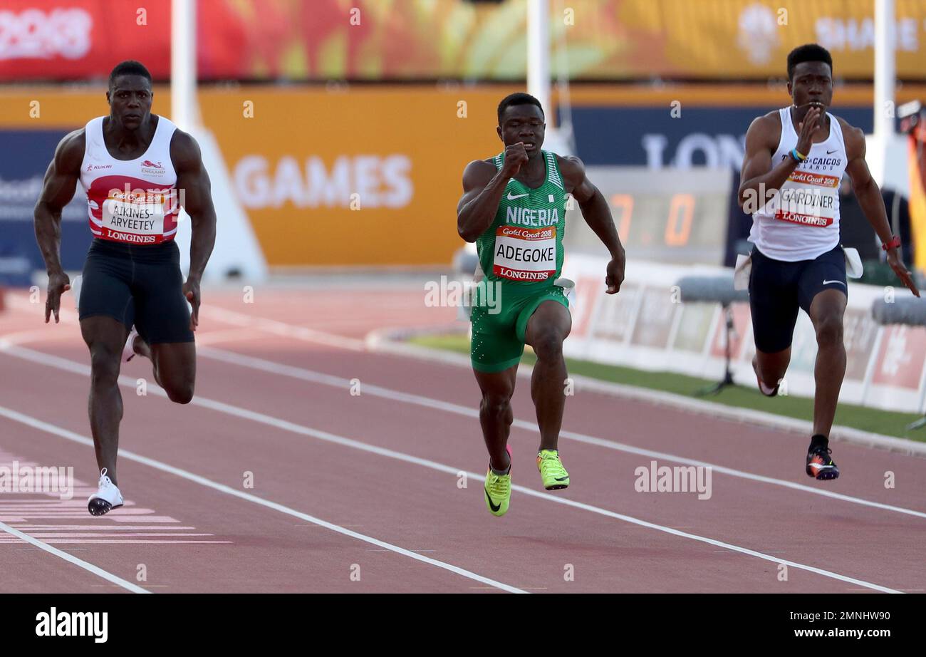 Nigeria's Enoch Olaoluwa Adegoke, centre, runs to a win in his men's ...