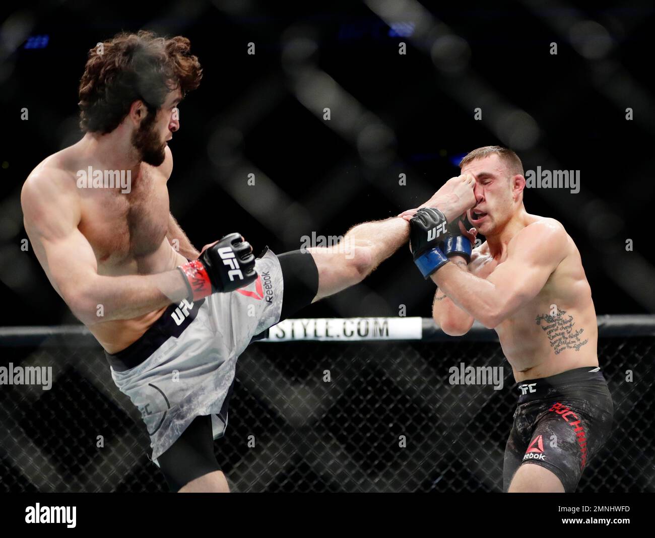 Russia's Zabit Magomedsharipov, left, kicks Kyle Bochniak during the ...