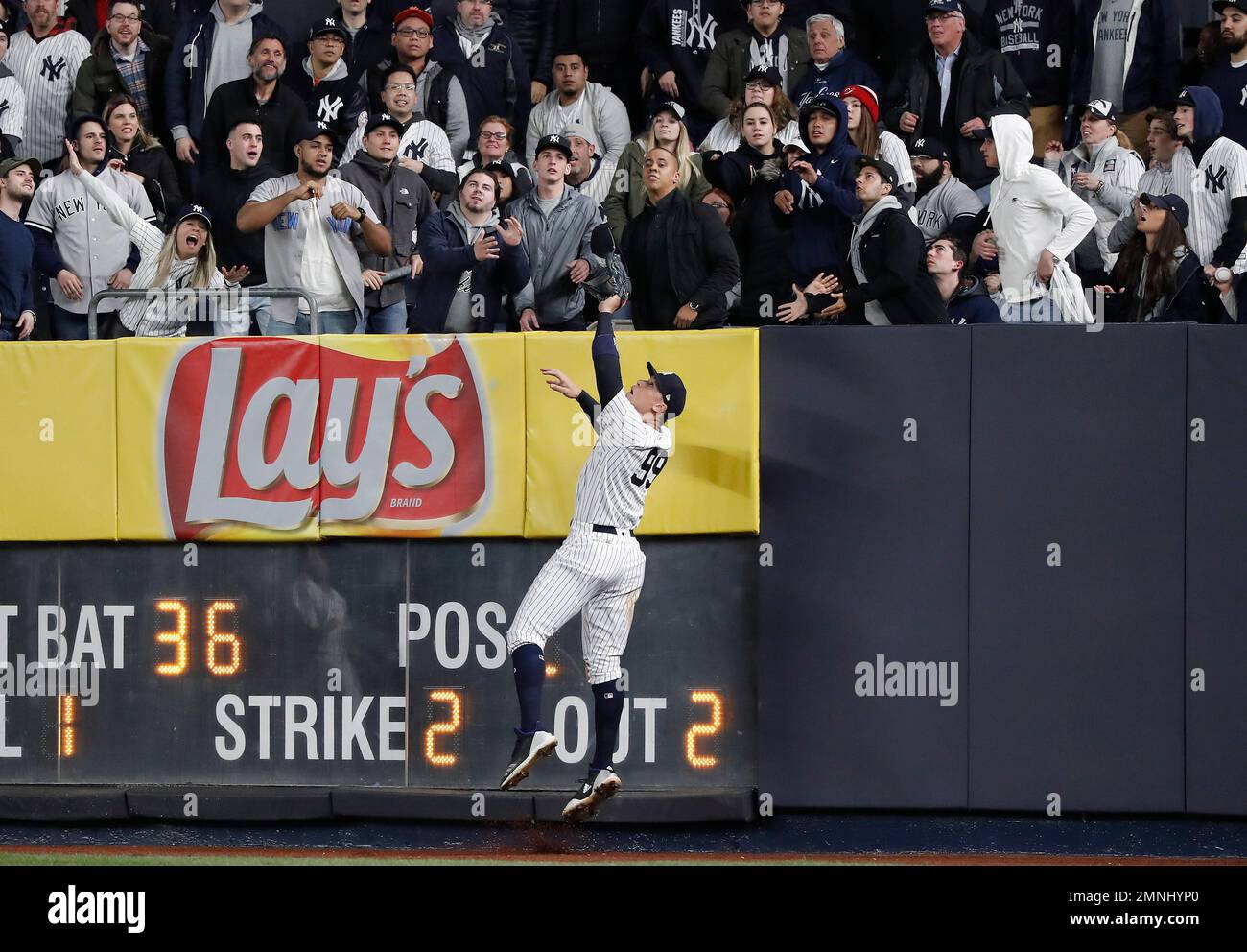New York Yankees right fielder Aaron Judge (99) makes a catch at the ...