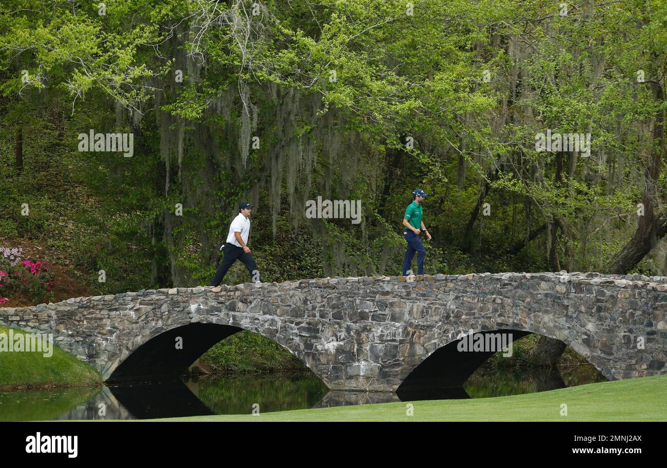 Patrick Reed and Charley Hoffman walks over the Nelson Bridge during ...