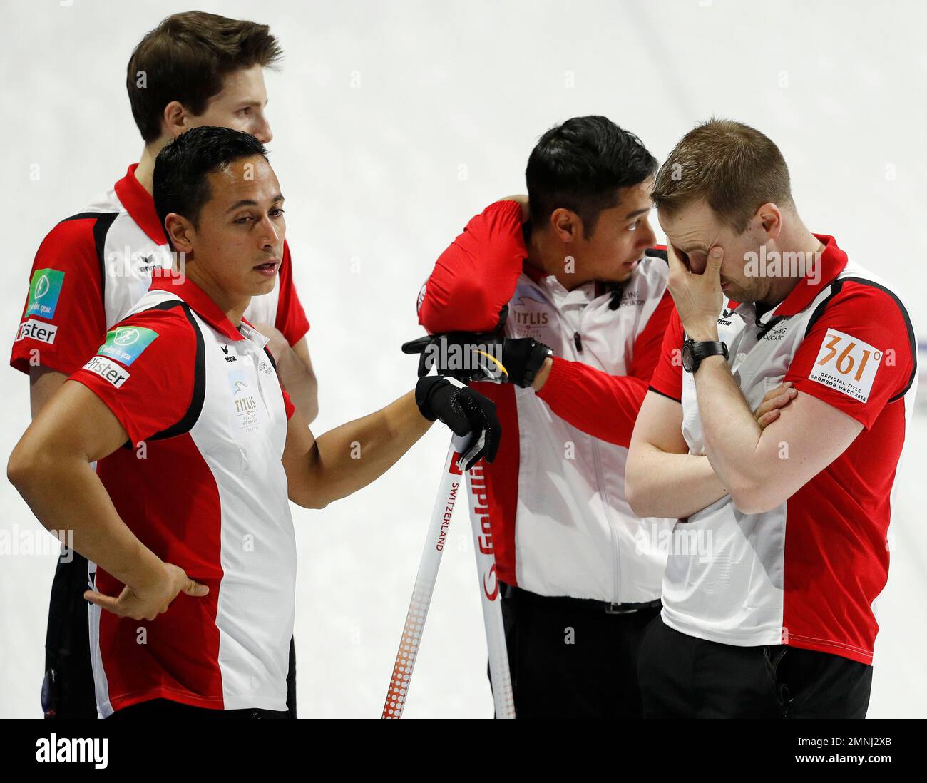 From left, Switzerland's Jan Hess, Enrico Pfister, skip Marc Pfister ...