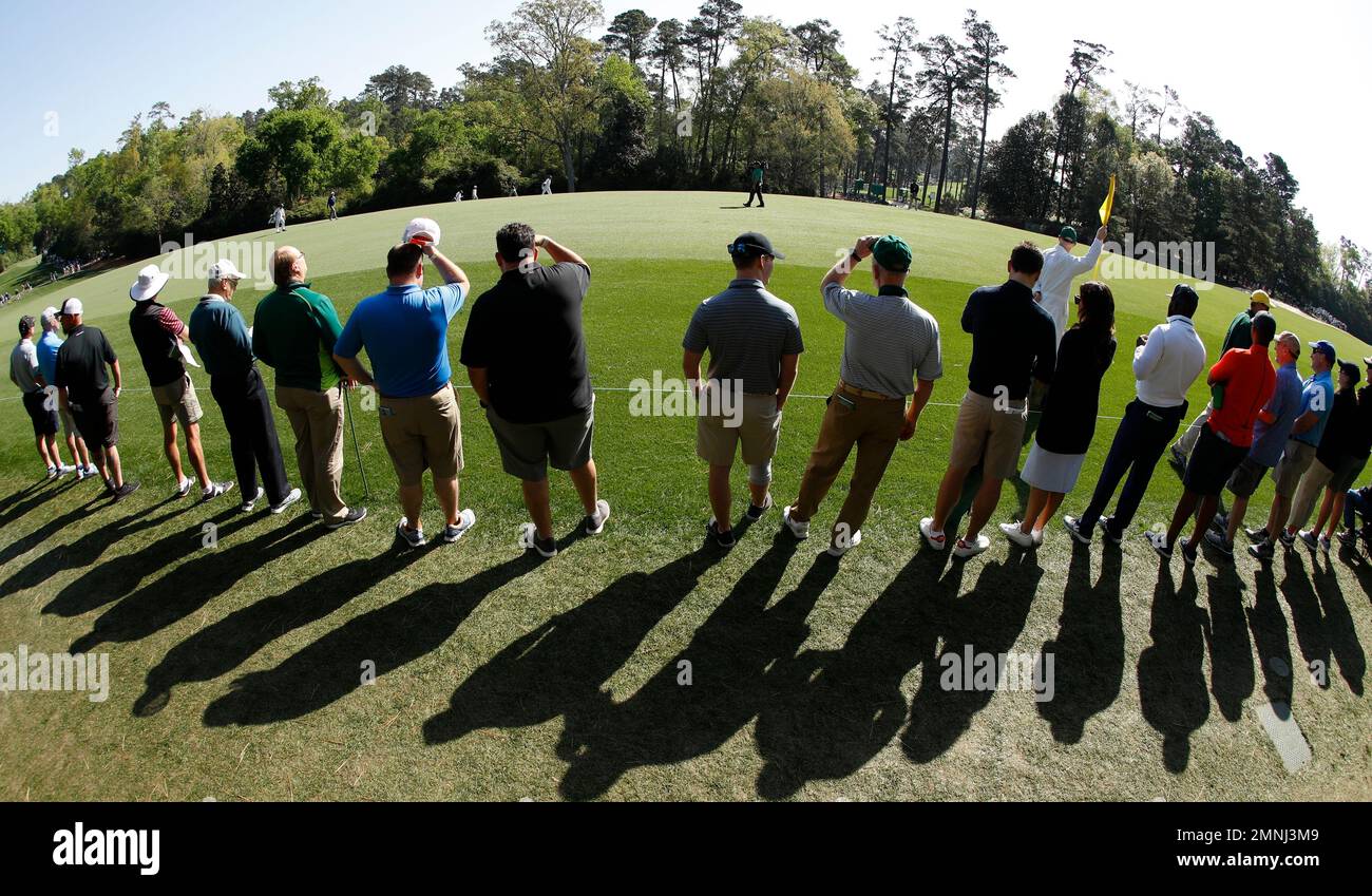 Fans line up on the fifth hole during the second round at the Masters ...