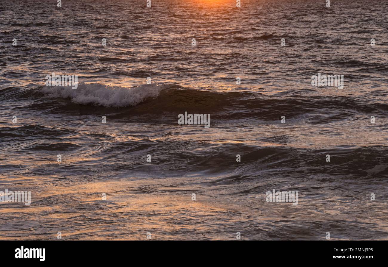 Sunlight reflected in ocean surface Stock Photo - Alamy