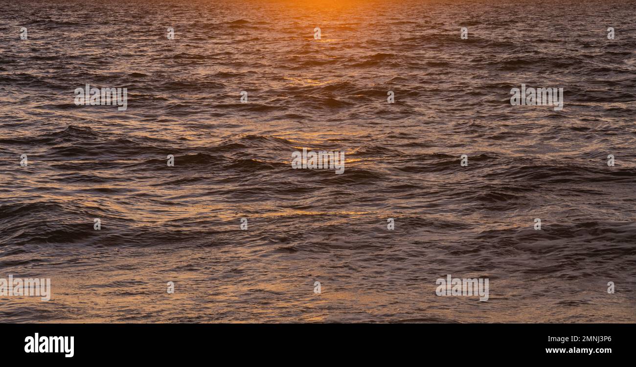 Sunlight reflected in ocean surface Stock Photo - Alamy