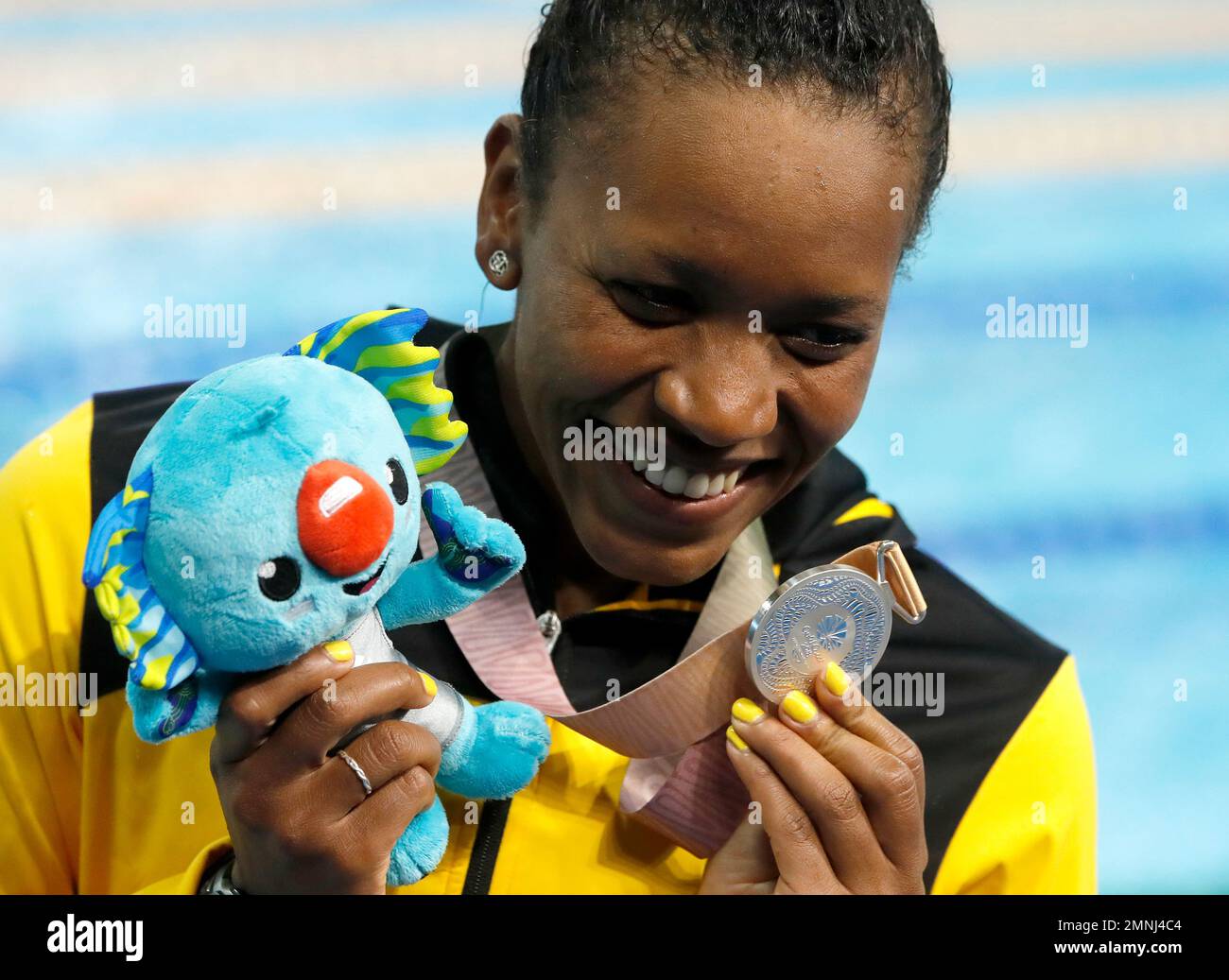 Jamaica's Alia Atkinson holds her medal after winning a silver medal in ...