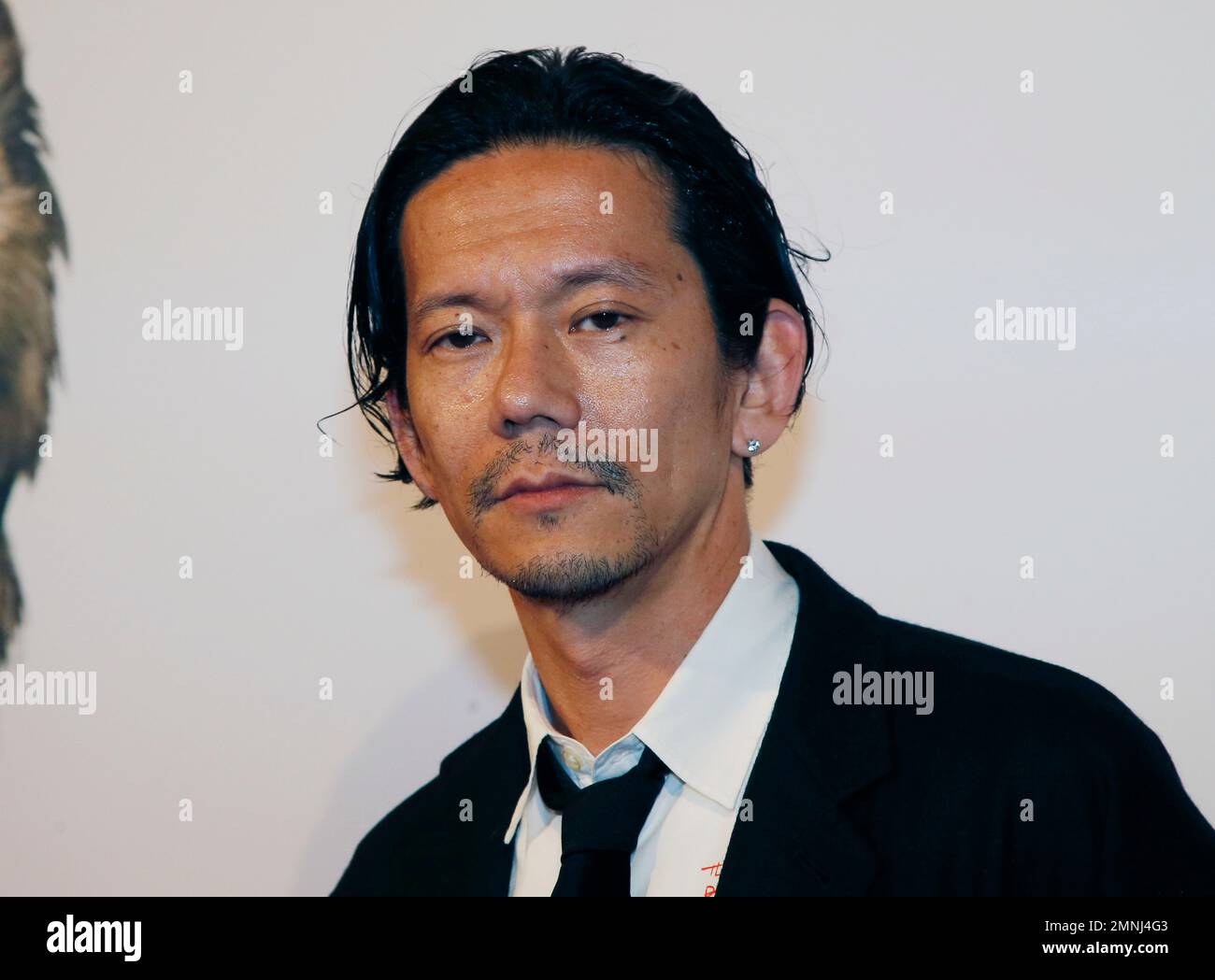 Japanese actor Kunichi Nomura poses before the French premiere of "Isle ...