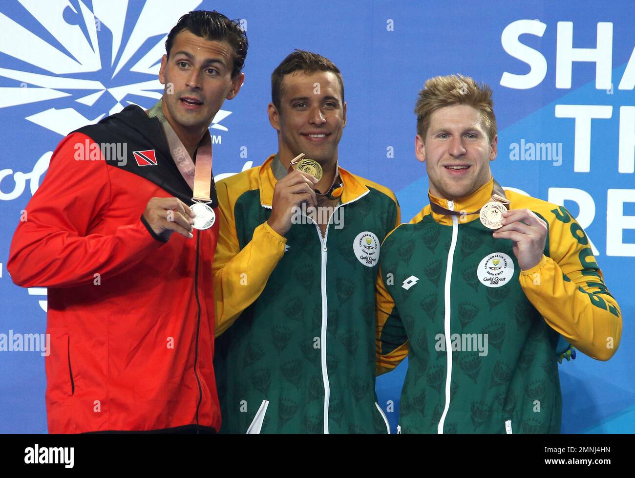 Men's 50m butterfly gold medalist South Africa's Chad Le Clos, centre ...